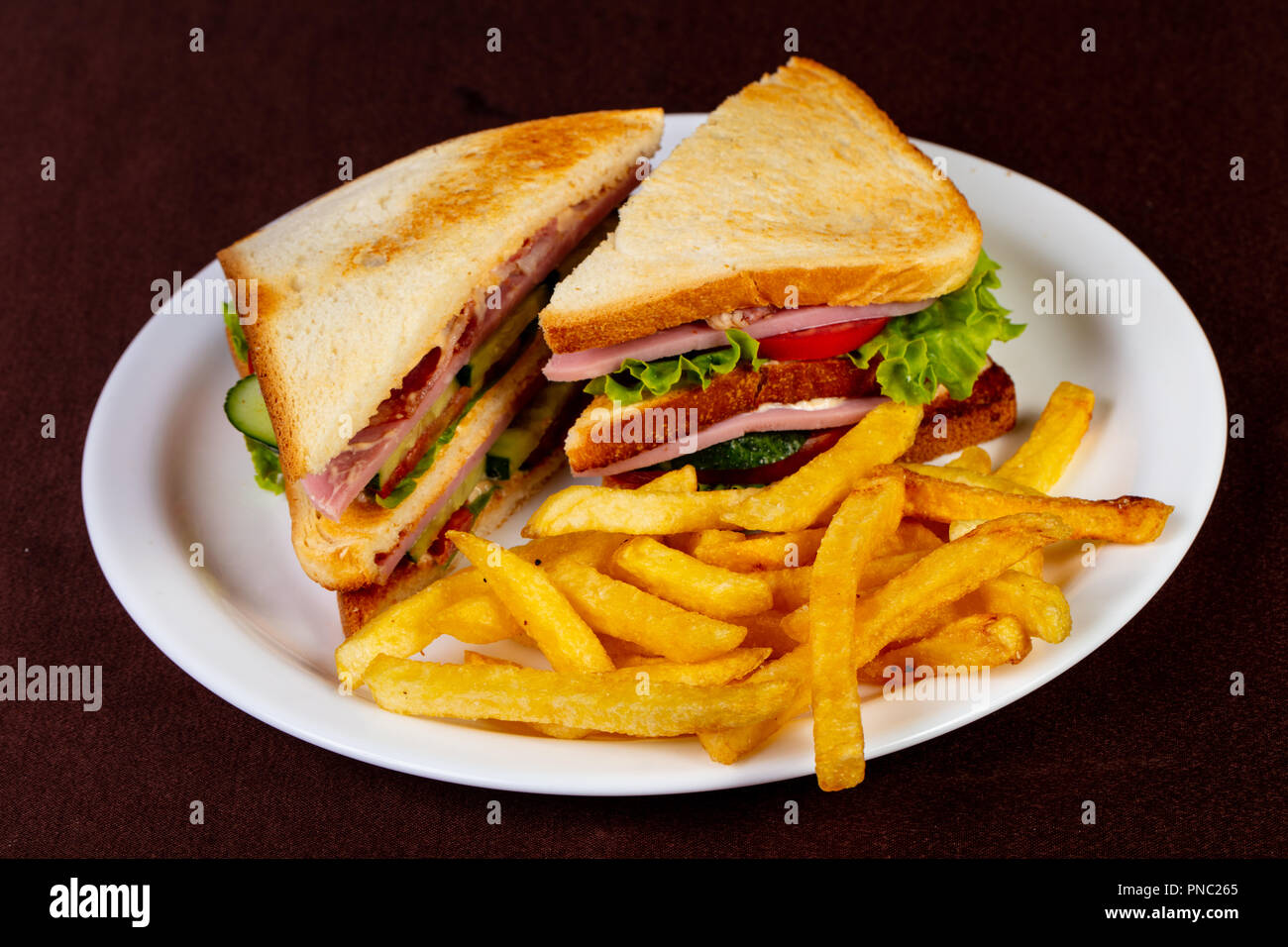 Club sandwich with ham and cheese Stock Photo - Alamy