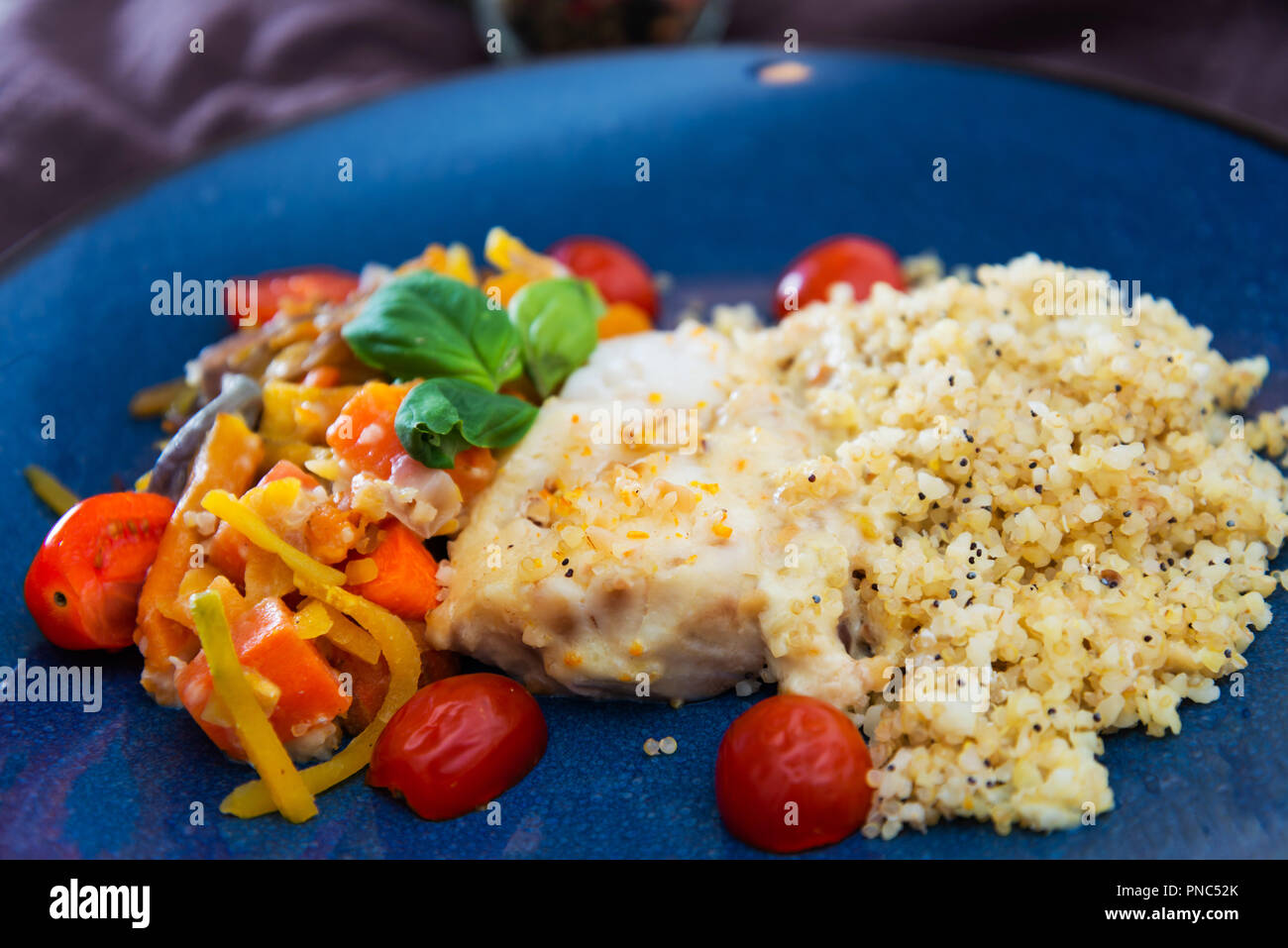 Andalusian fish, saffron rice with vegetables Stock Photo - Alamy