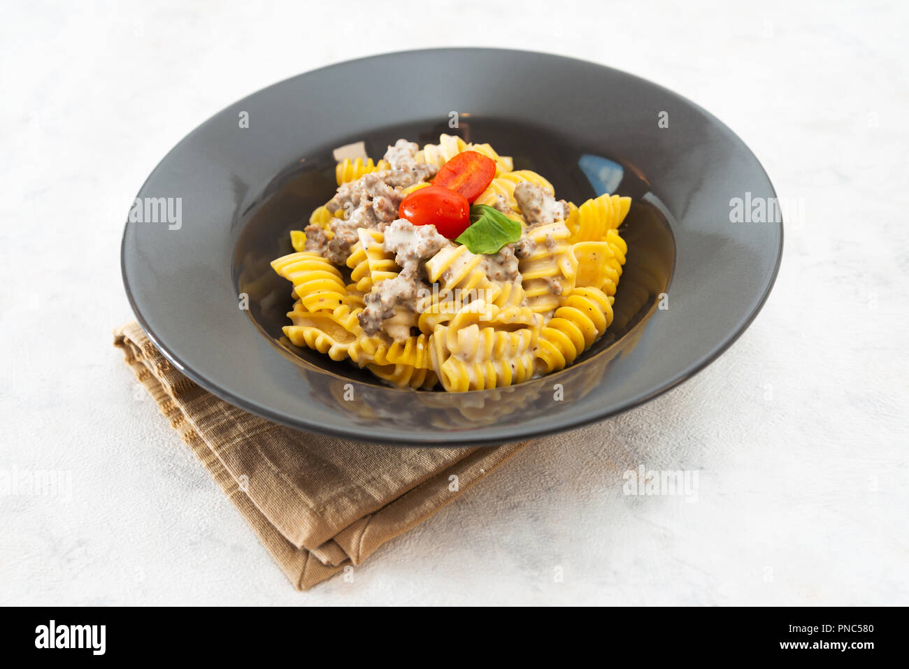 Radiatori pasta in a creamy tomato parmesan cheese sauce Stock Photo ...