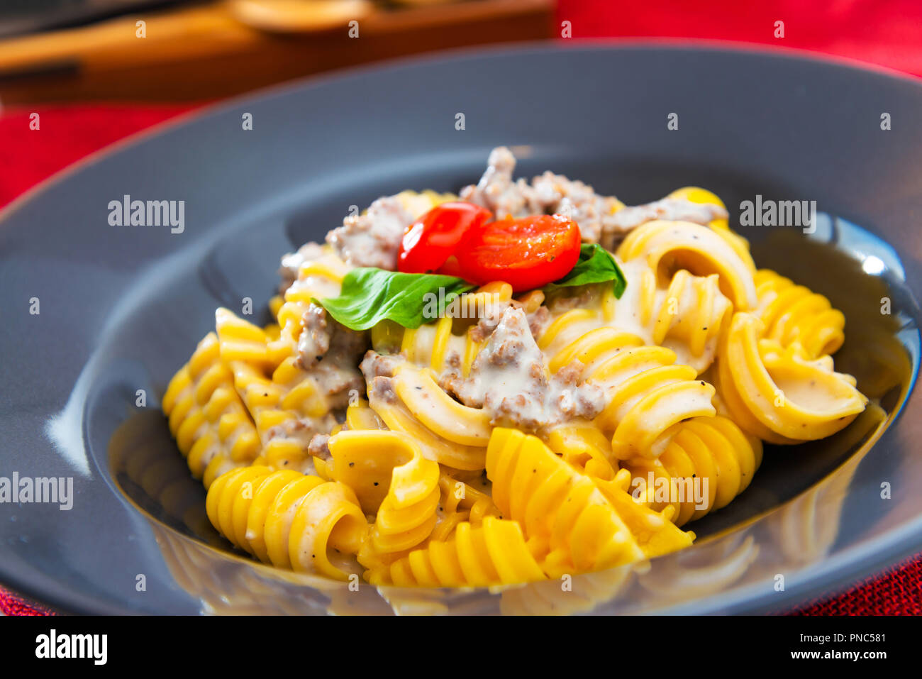 Radiatori pasta in a creamy tomato parmesan cheese sauce Stock Photo ...
