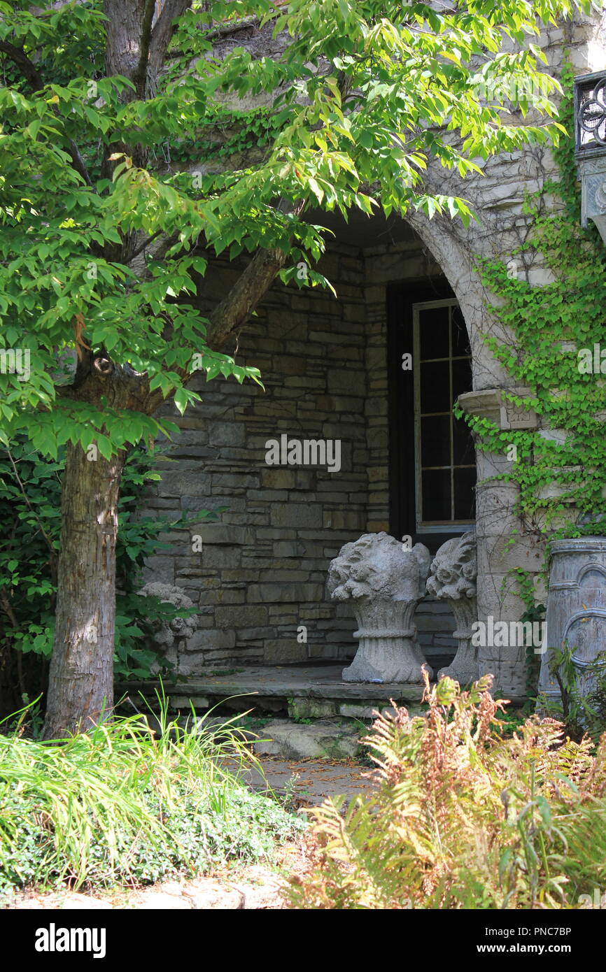 High end vintage home and entry detail on a stone building wall Stock ...