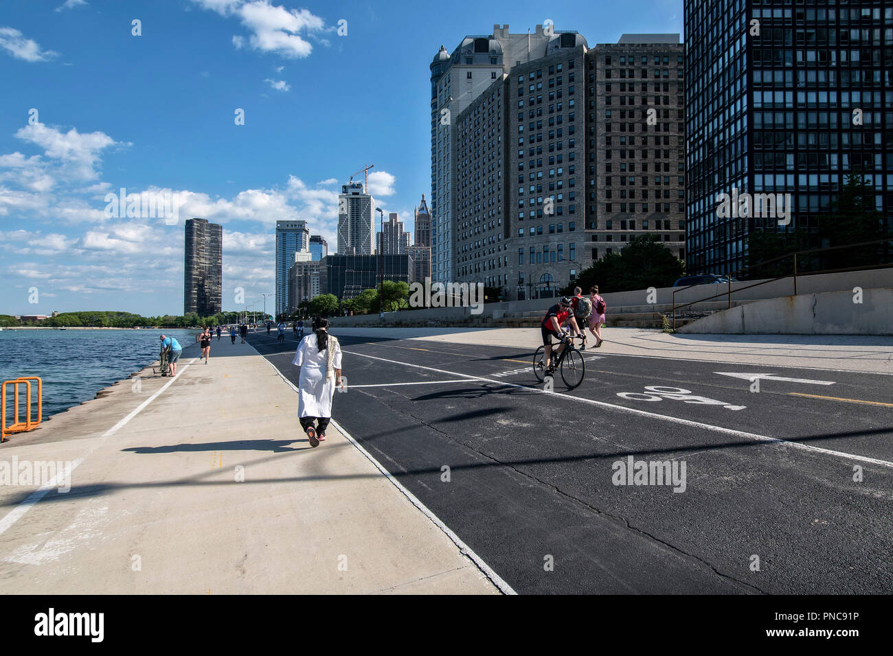 Bicycle riders and pedestrians on Lakefront Trail on Lake Shore Drive ...