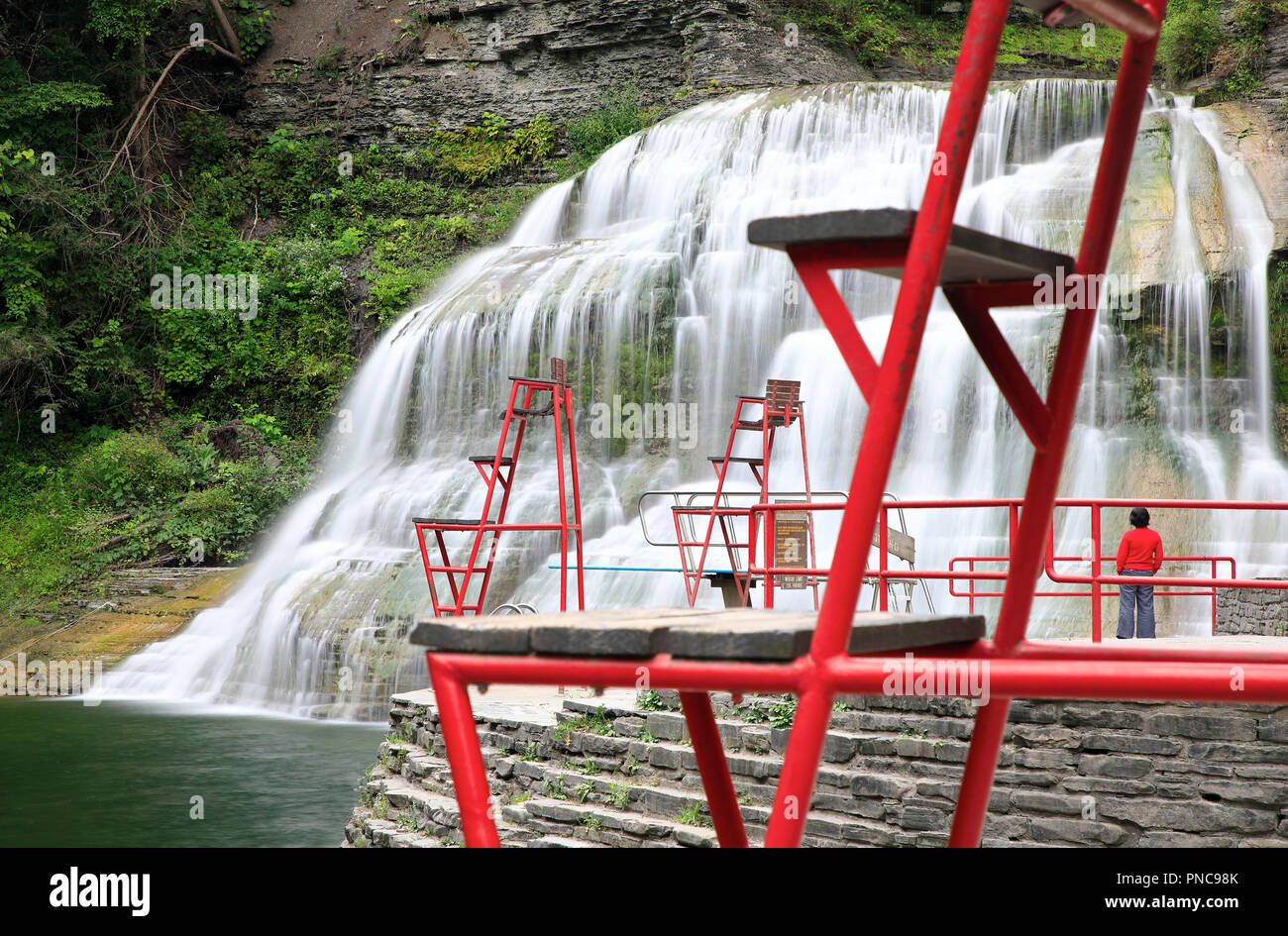 Lifeguard's chair in the swimming pool with the lower Enfield Falls of ...