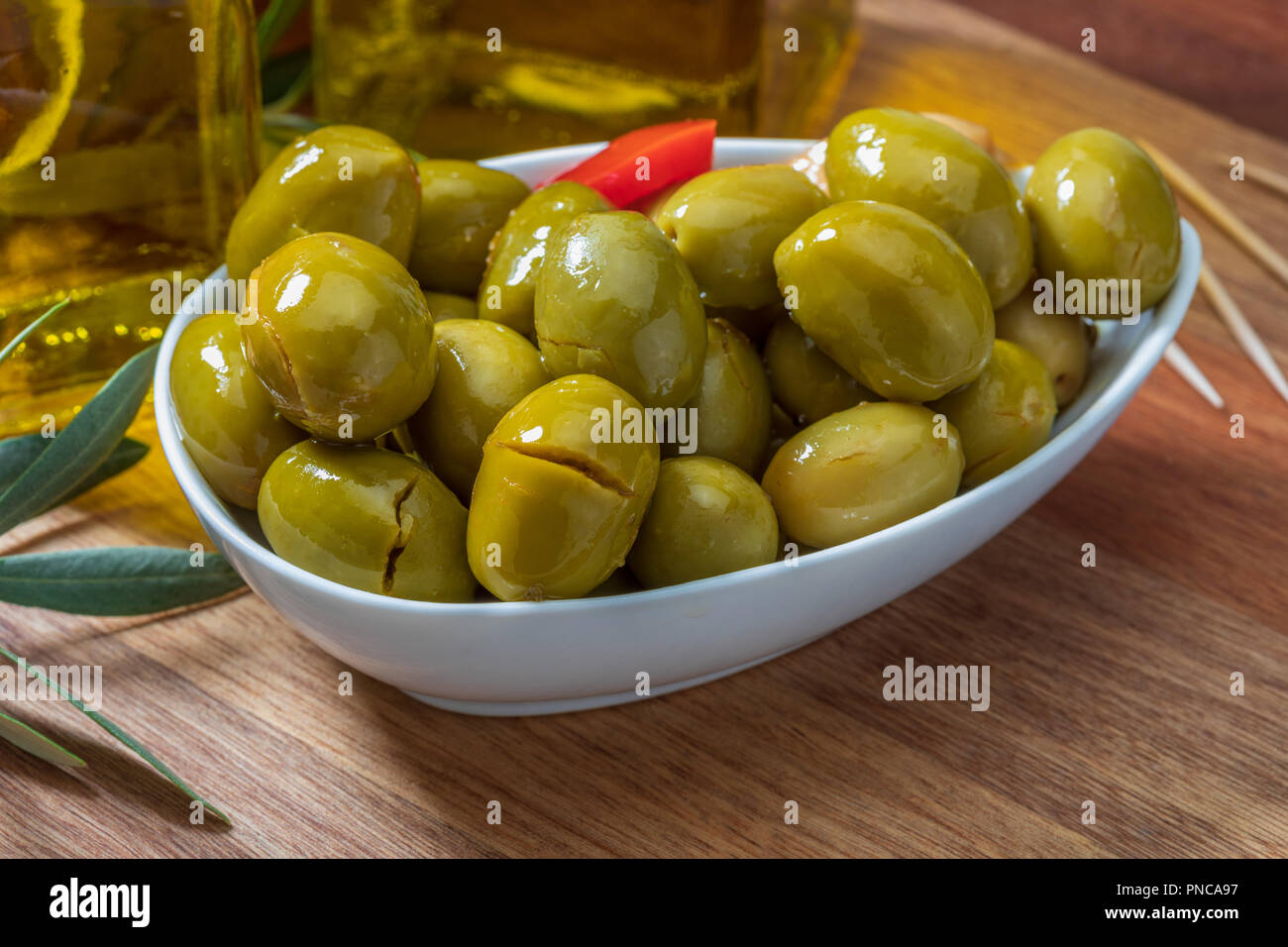 Artisan olives (canned in extra virgin olive oil, vinegar, spices) with ...