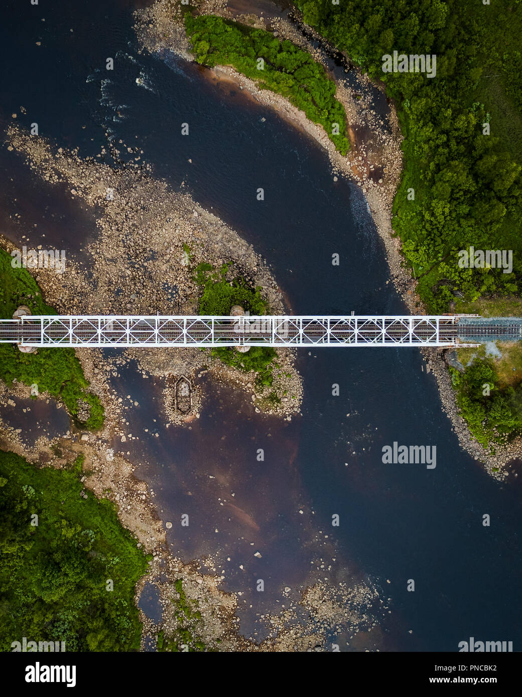 Steel railroad bridge over river in northern Finland seen from the air ...