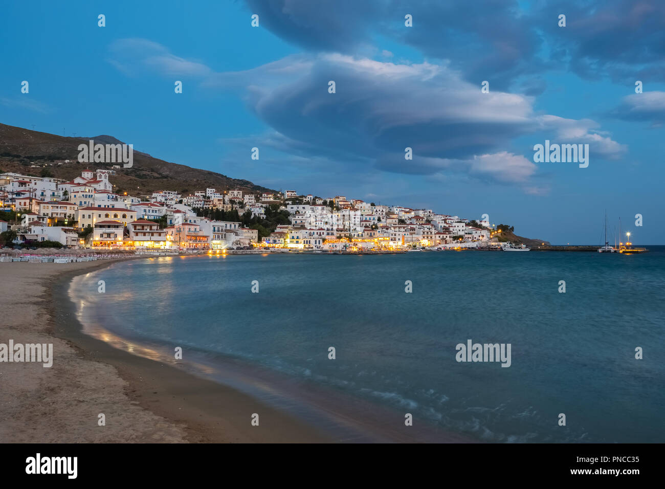 Picturesque Batsi village on Andros island at night, Cyclades, Greece ...