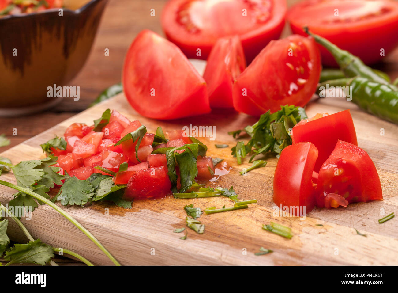 A close up view of cutting ingredient to make salsa Stock Photo - Alamy