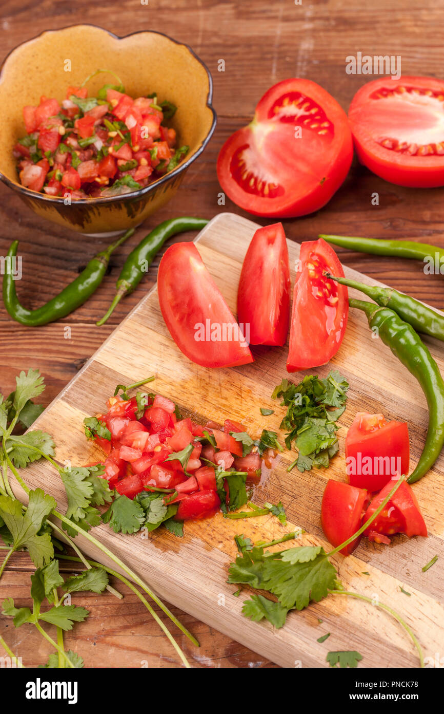 A close up view of cutting ingredient to make salsa Stock Photo - Alamy