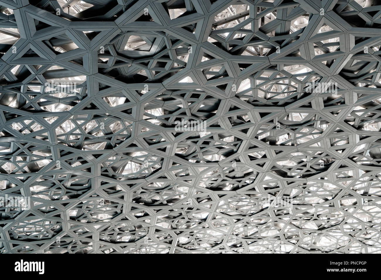 Detail of steel roof dome steelwork pattern of the Louvre Abu Dhabi at ...
