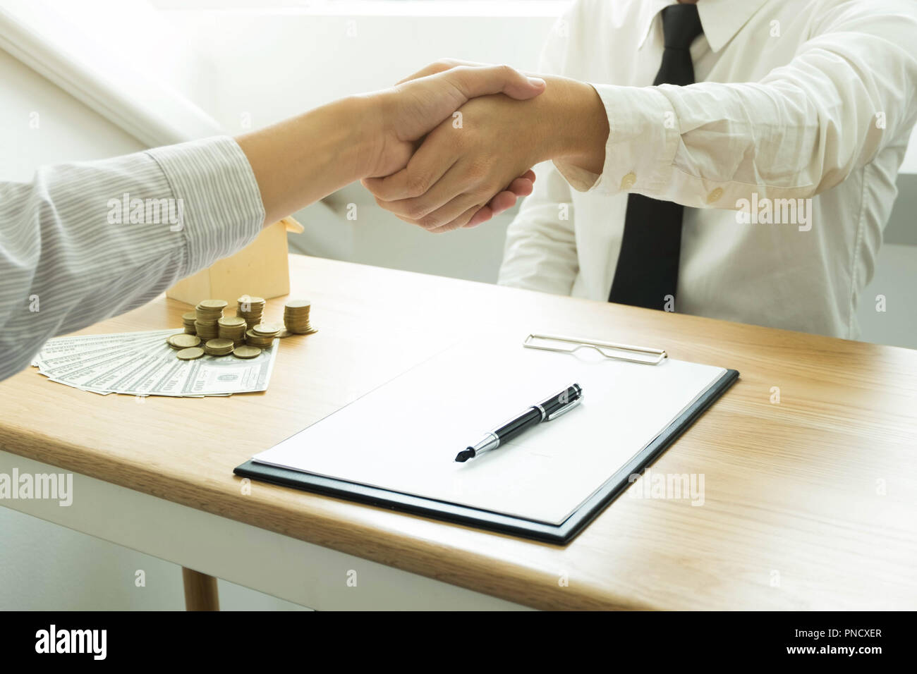 Business handshake. Business people shaking hands, finishing up a ...