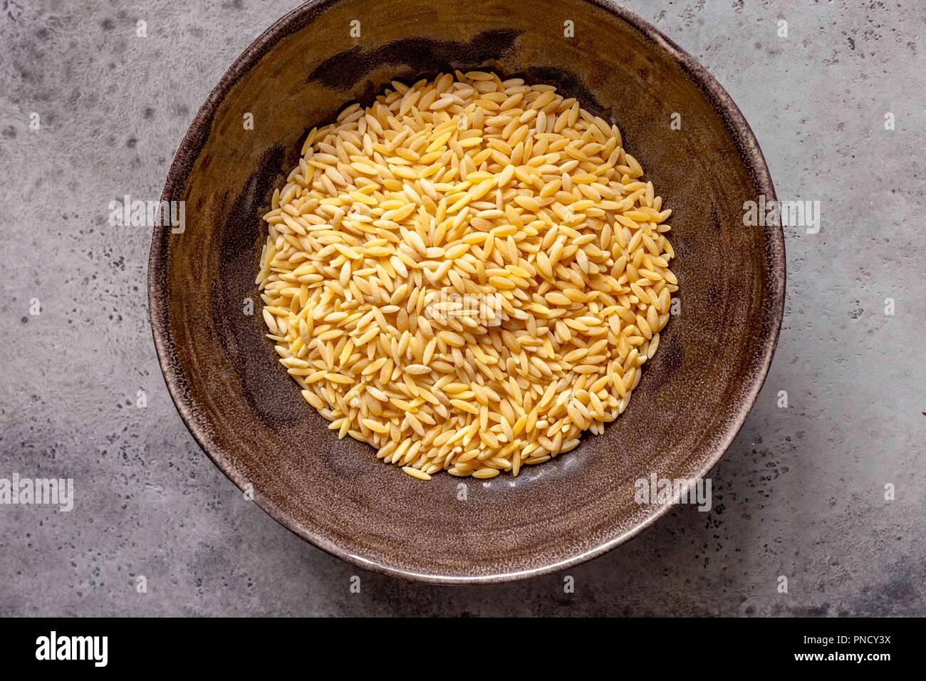 Uncooked Orzo Pasta Stock Photo - Alamy