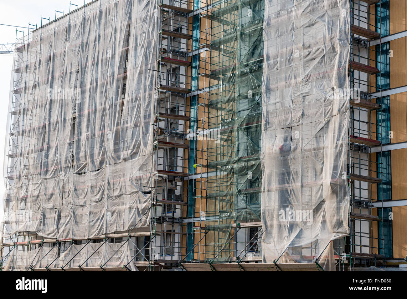 scaffolding set up next to the new building Stock Photo - Alamy