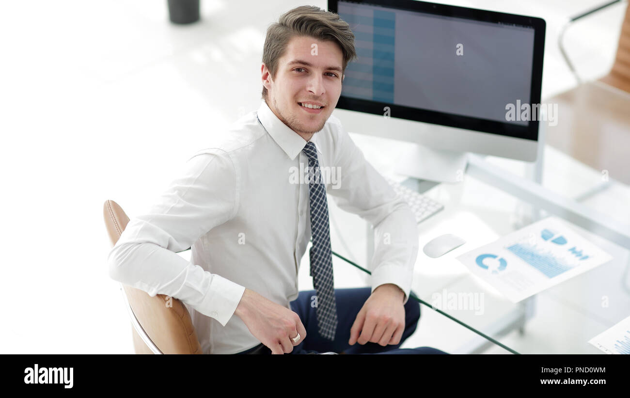 employee sitting in front of a computer screen Stock Photo - Alamy