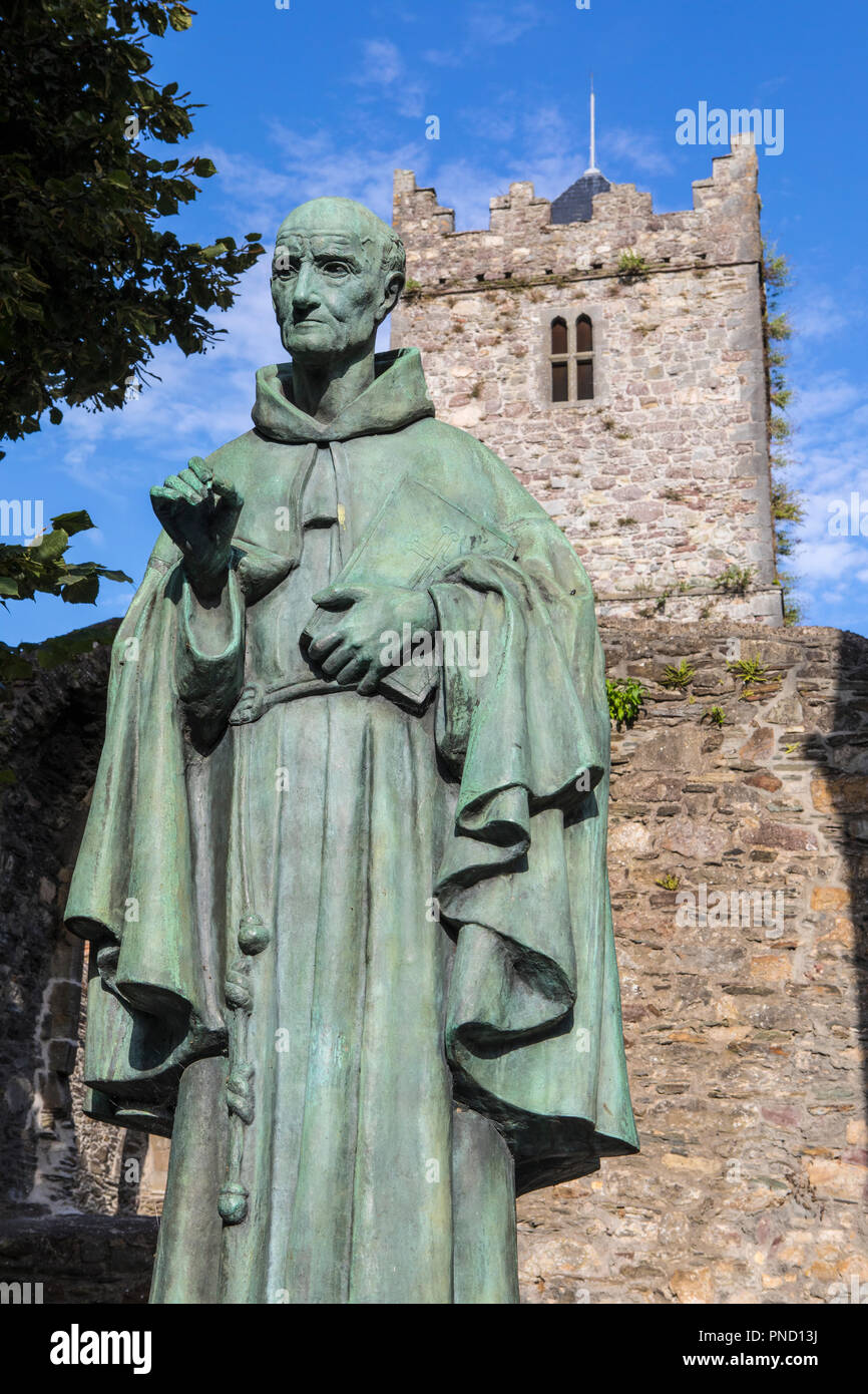 A statue of Irish Franciscan friar Luke Wadding with the French Church ...