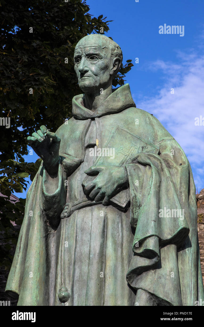 A statue of Irish Franciscan friar Luke Wadding, in the historic city ...