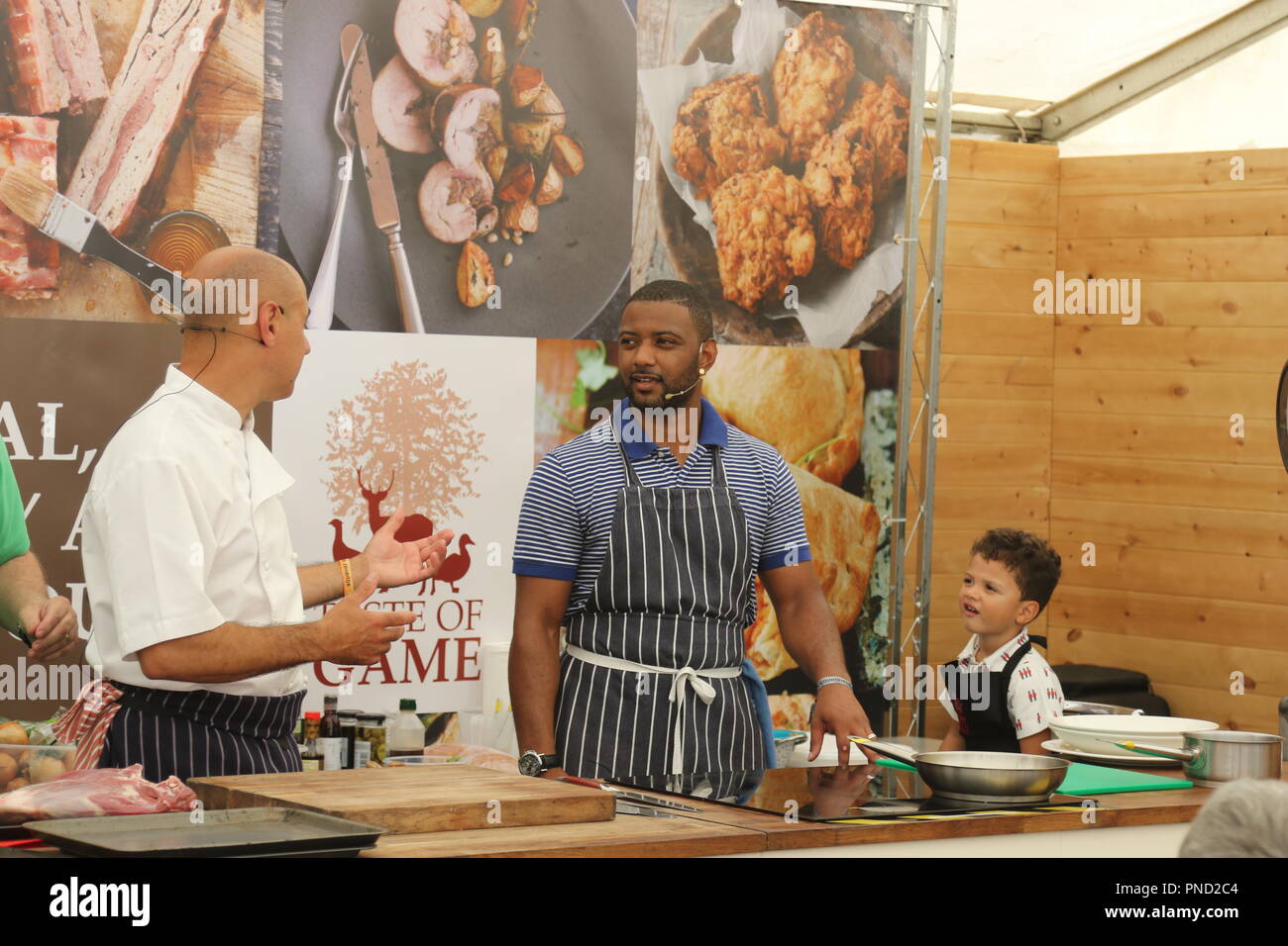 Taste of game JLS star cooking country fair Stock Photo - Alamy