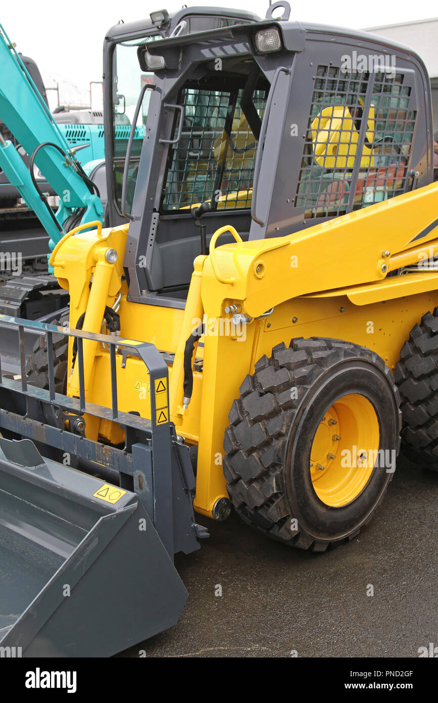 Skid Steer Front Loader Machine at Construction Site Stock Photo - Alamy