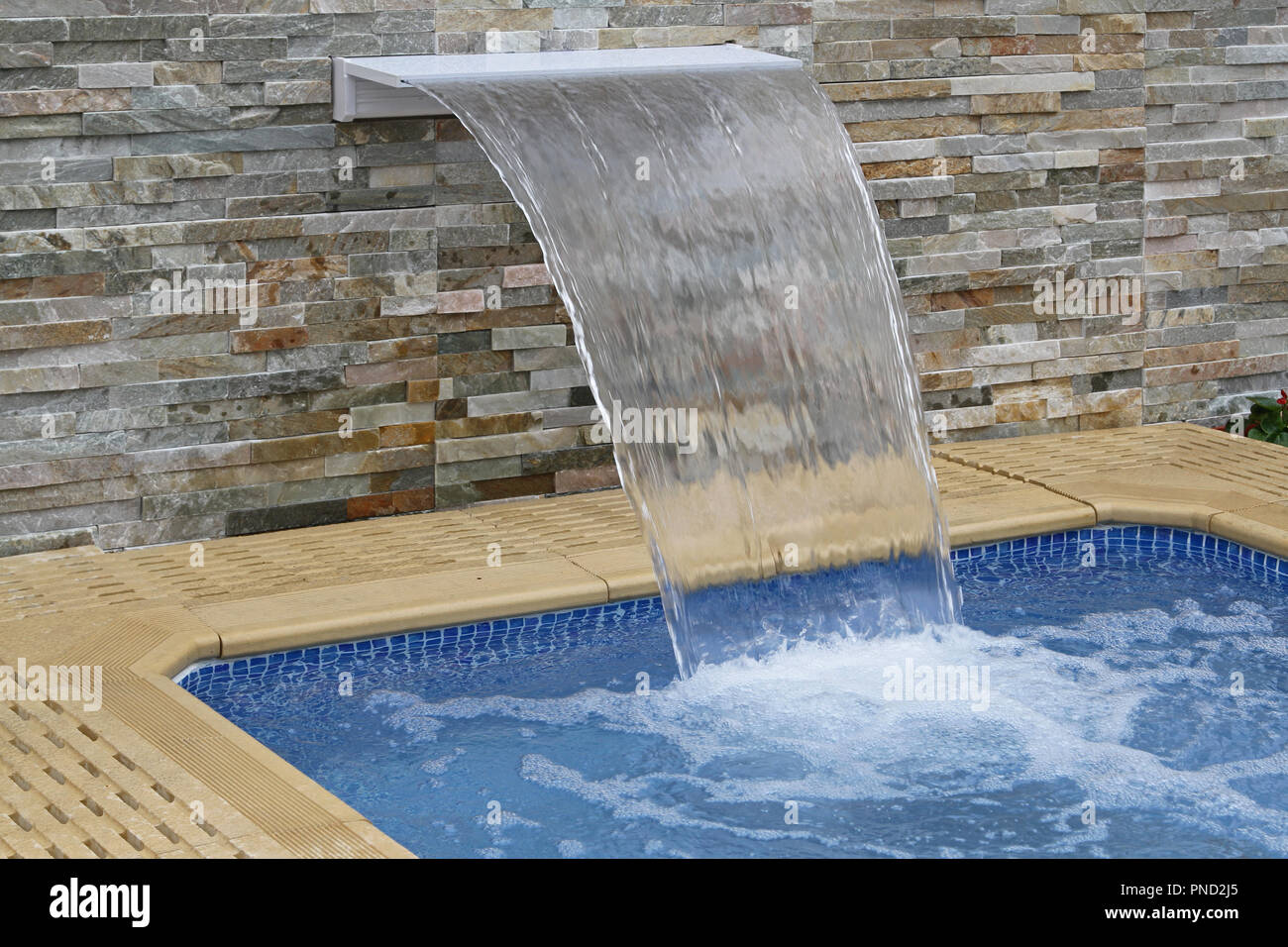 Small Modern Spa Swimming Pool With Waterfalls Stock Photo - Alamy