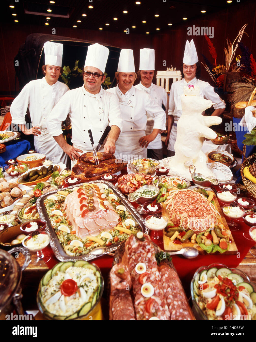 1980s FIVE SMILING CHEFS STANDING BEHIND IMMENSE BUFFET OF MEAT AND ...