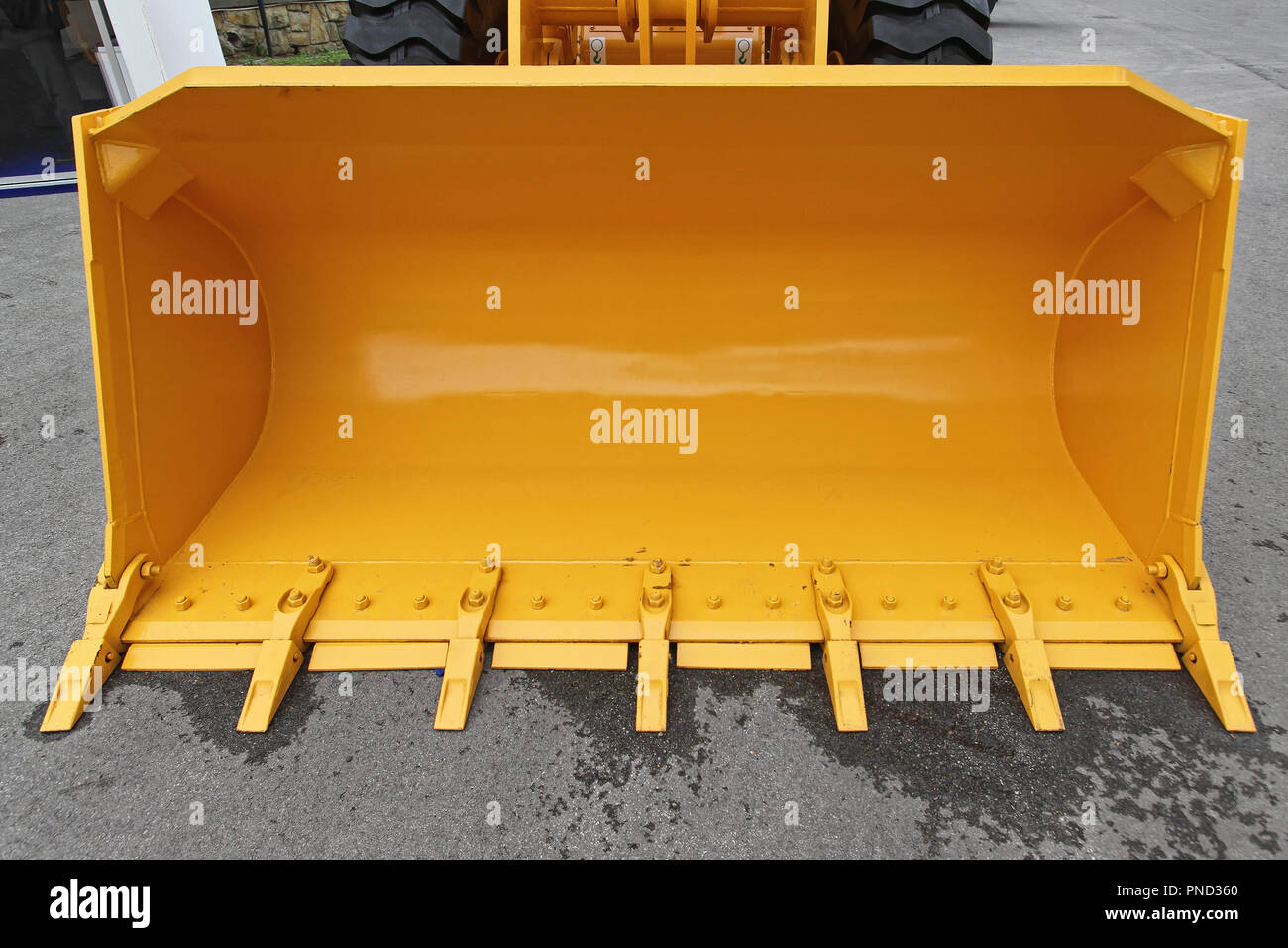 Big Yellow Bucket Scoop at Front Loader Machine Stock Photo - Alamy