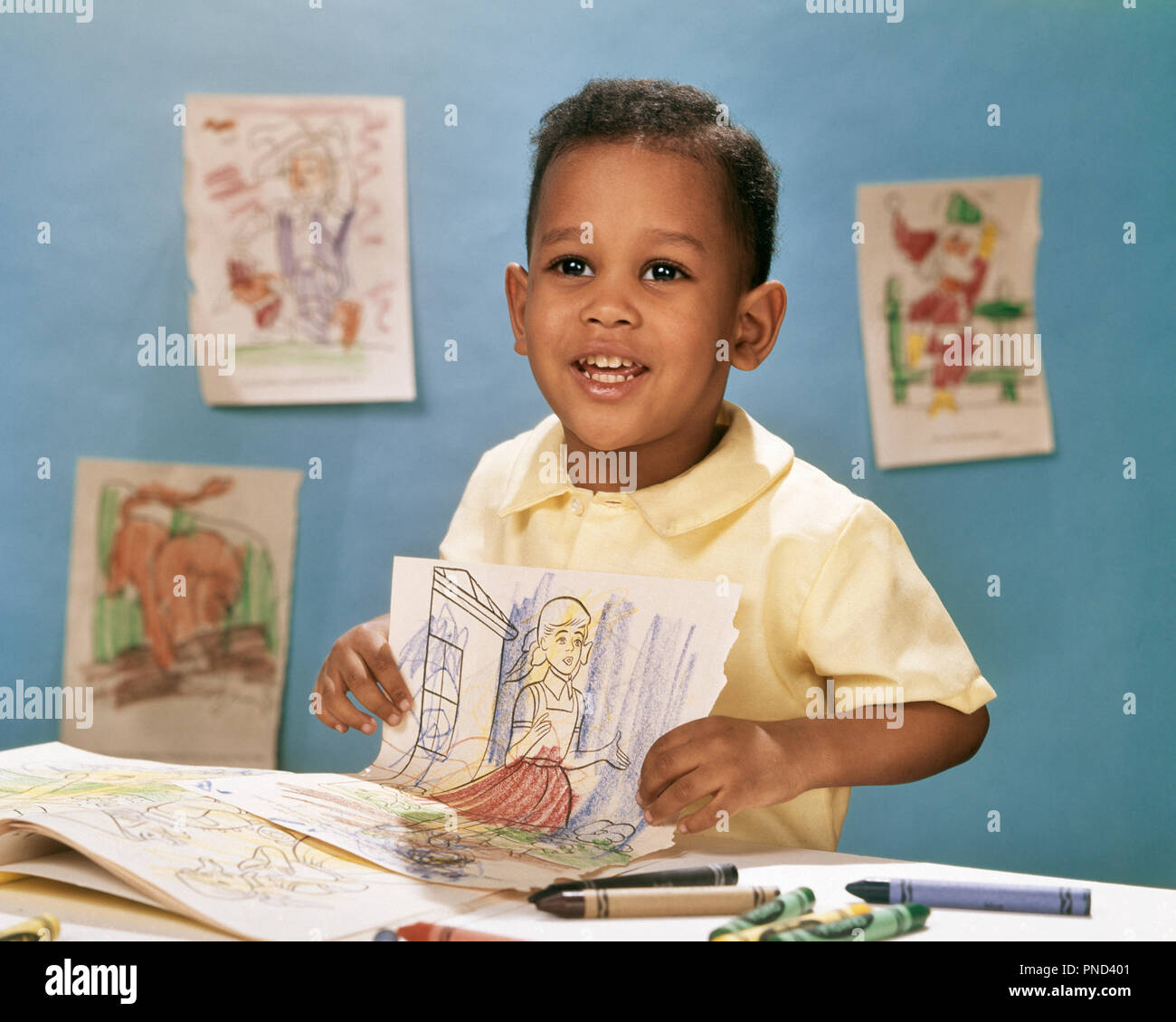 1970s LITTLE AFRICAN AMERICAN BOY SHOWING OFF HIS CRAYON DRAWING ...