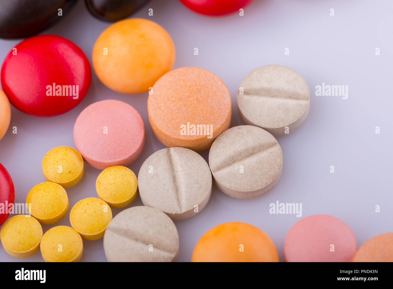 Tablets pills capsule heap mix therapy drugs, over a white background ...