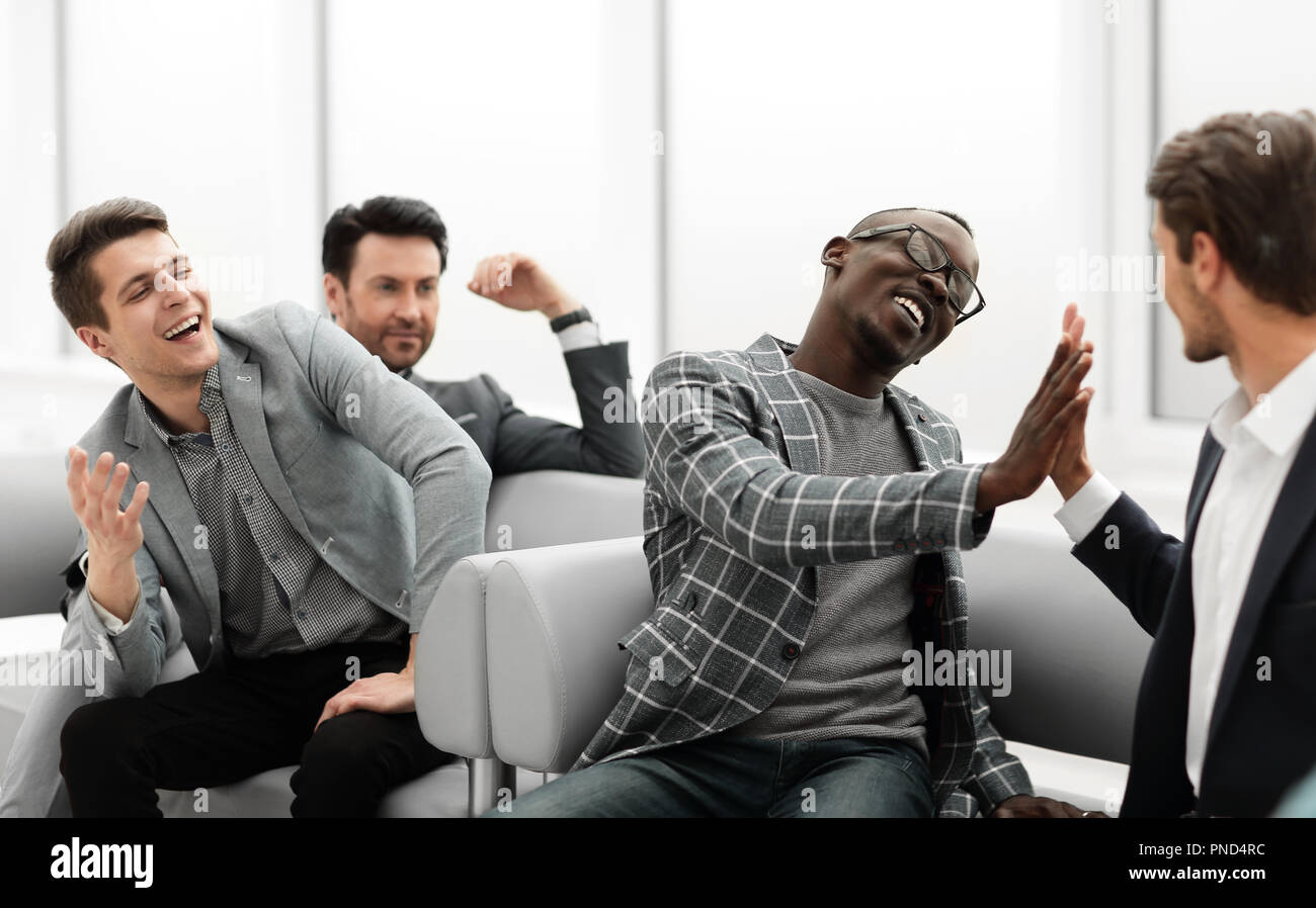 close up.cheerful co-workers giving each other a high five Stock Photo ...