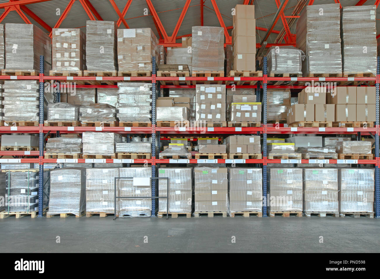 Shelving System With Boxes in Distribution Warehouse Stock Photo - Alamy