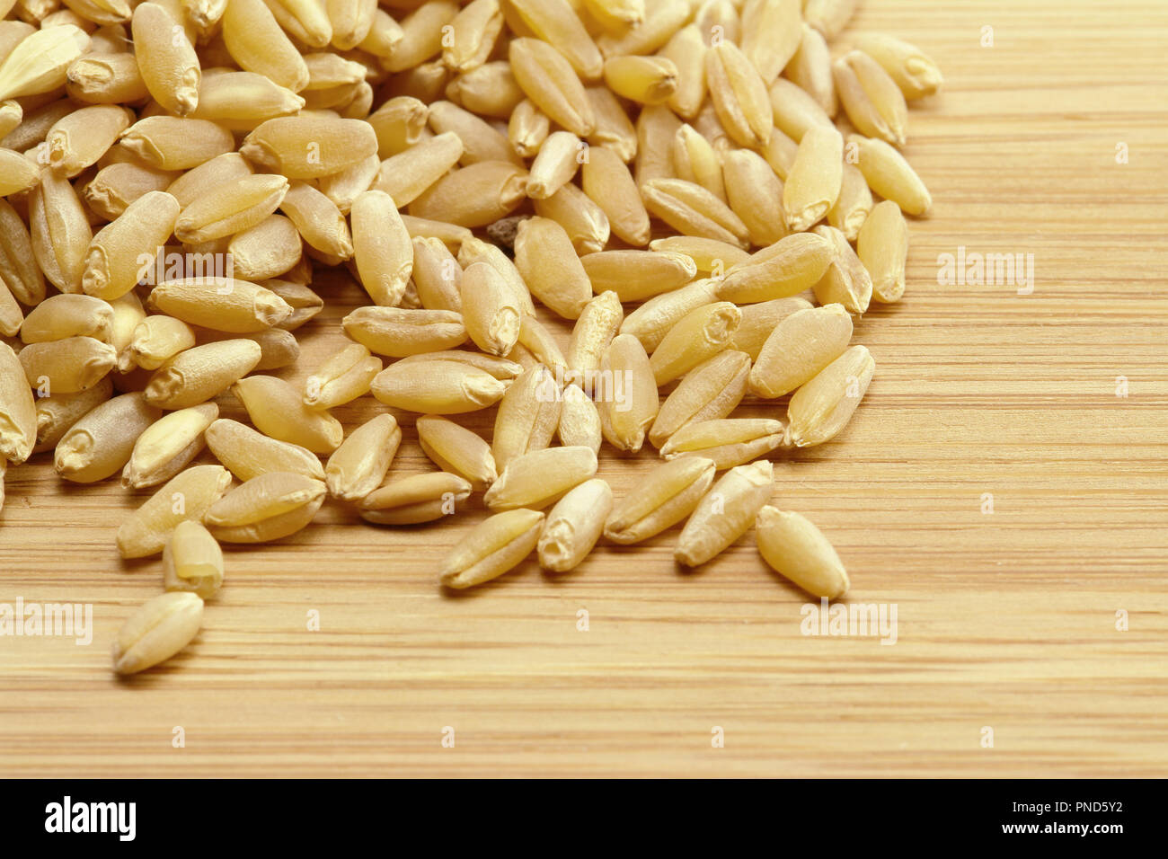 Wheat on wooden floor Stock Photo - Alamy