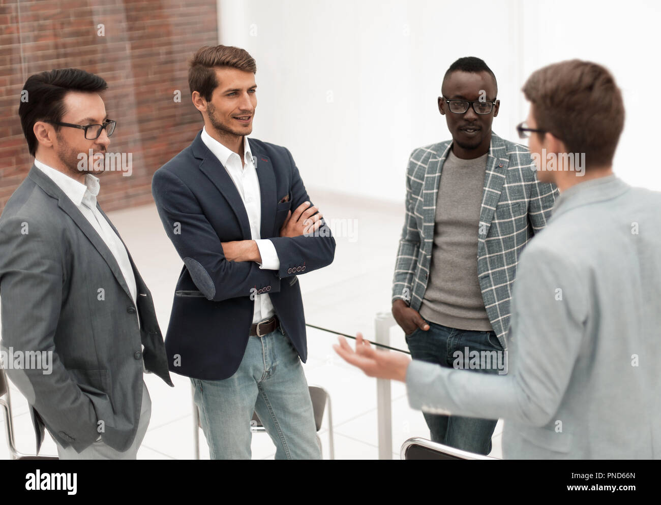 Business colleagues talk in a lobby hi-res stock photography and images ...