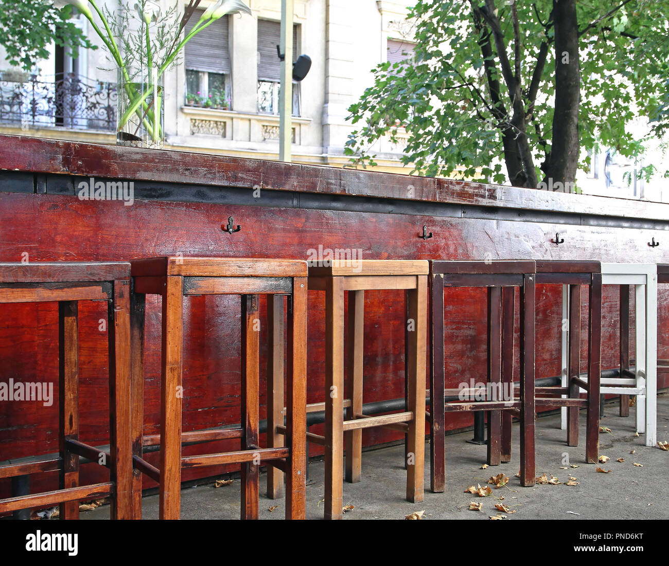 Wooden Stool Chairs at Red Wood Bar Counter Stock Photo - Alamy