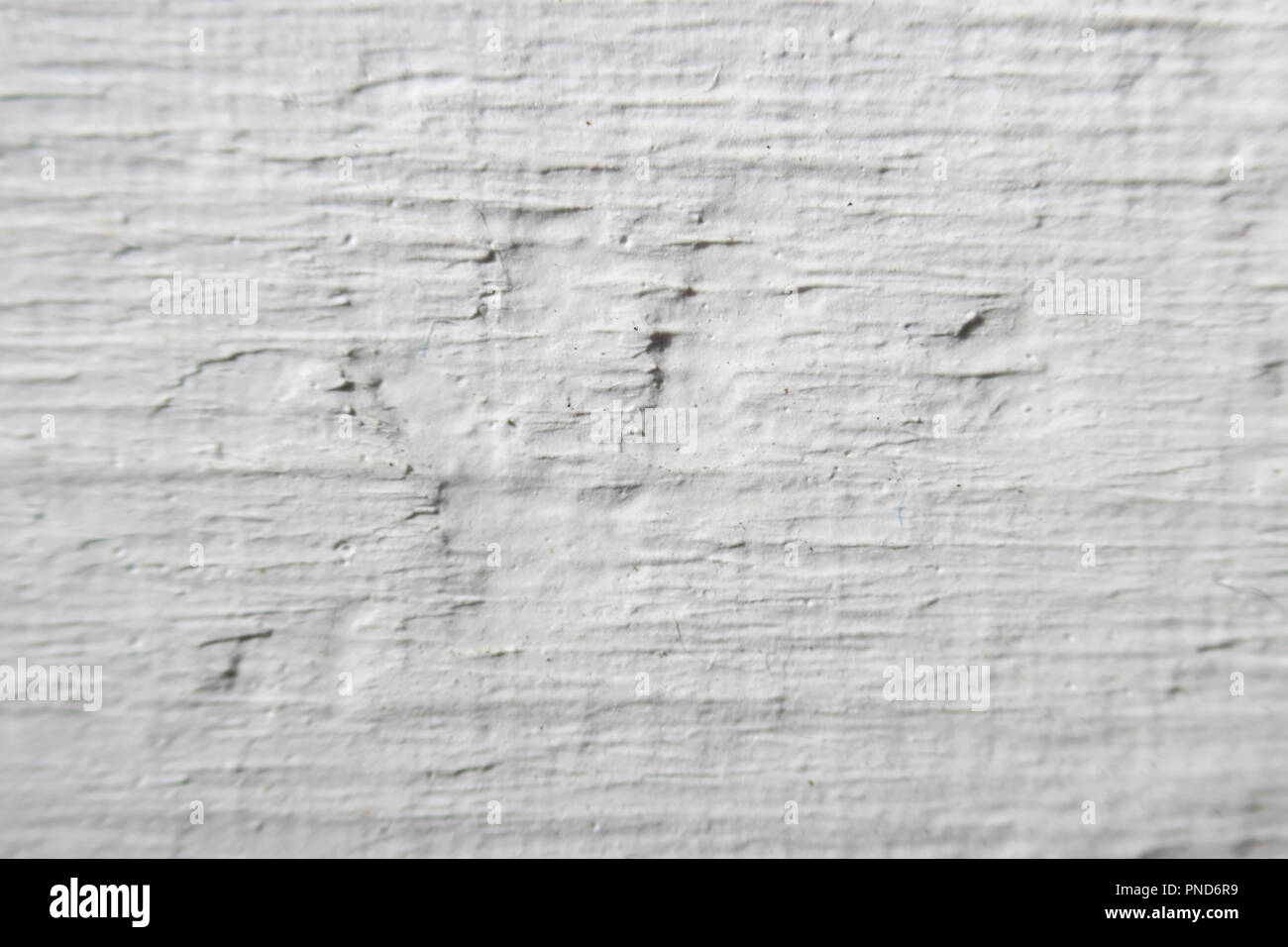 Decorative plaster effect on wall. white plaster lighted by daylight ...