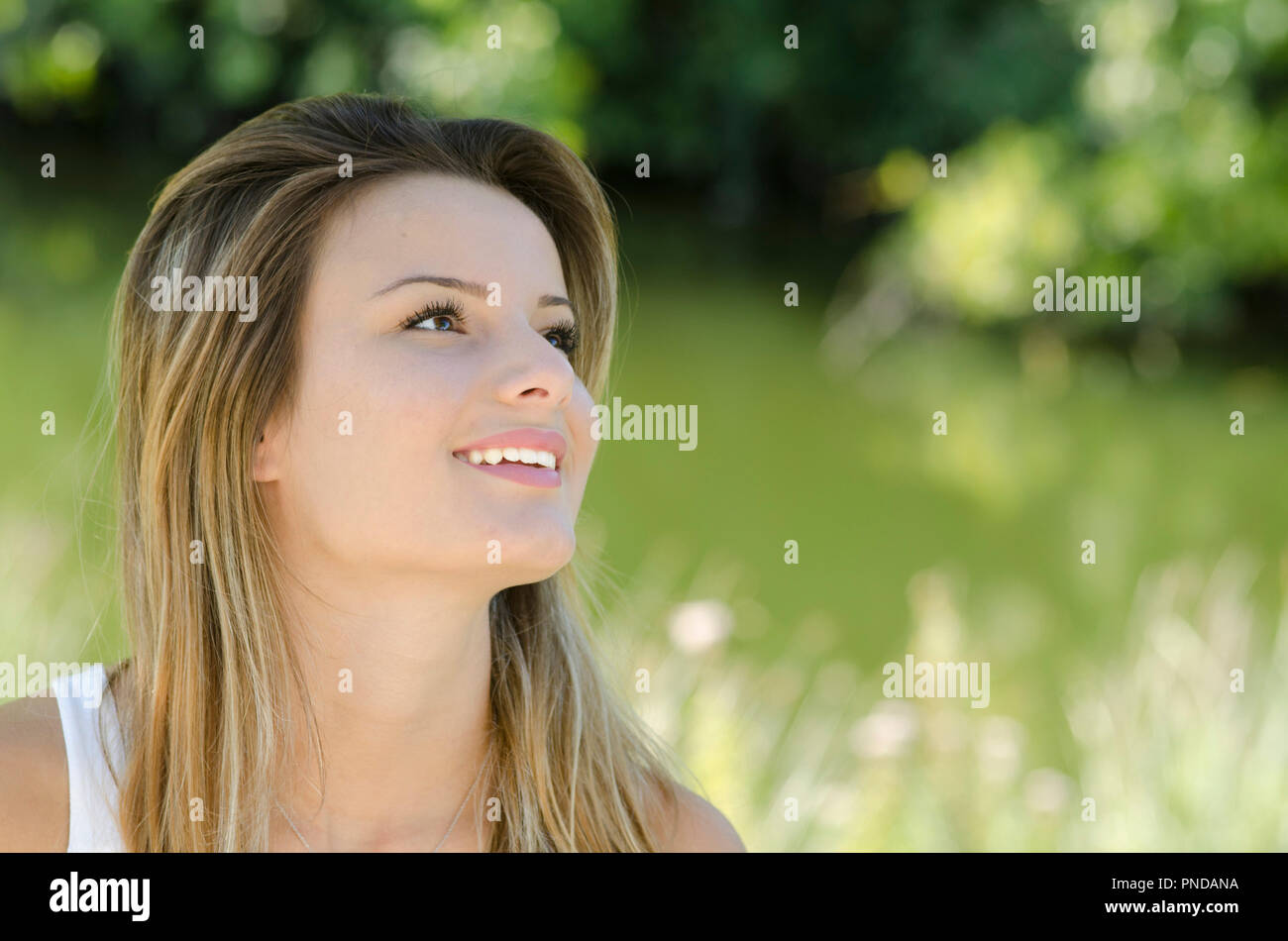 beautiful smiling girl on the left side Stock Photo - Alamy