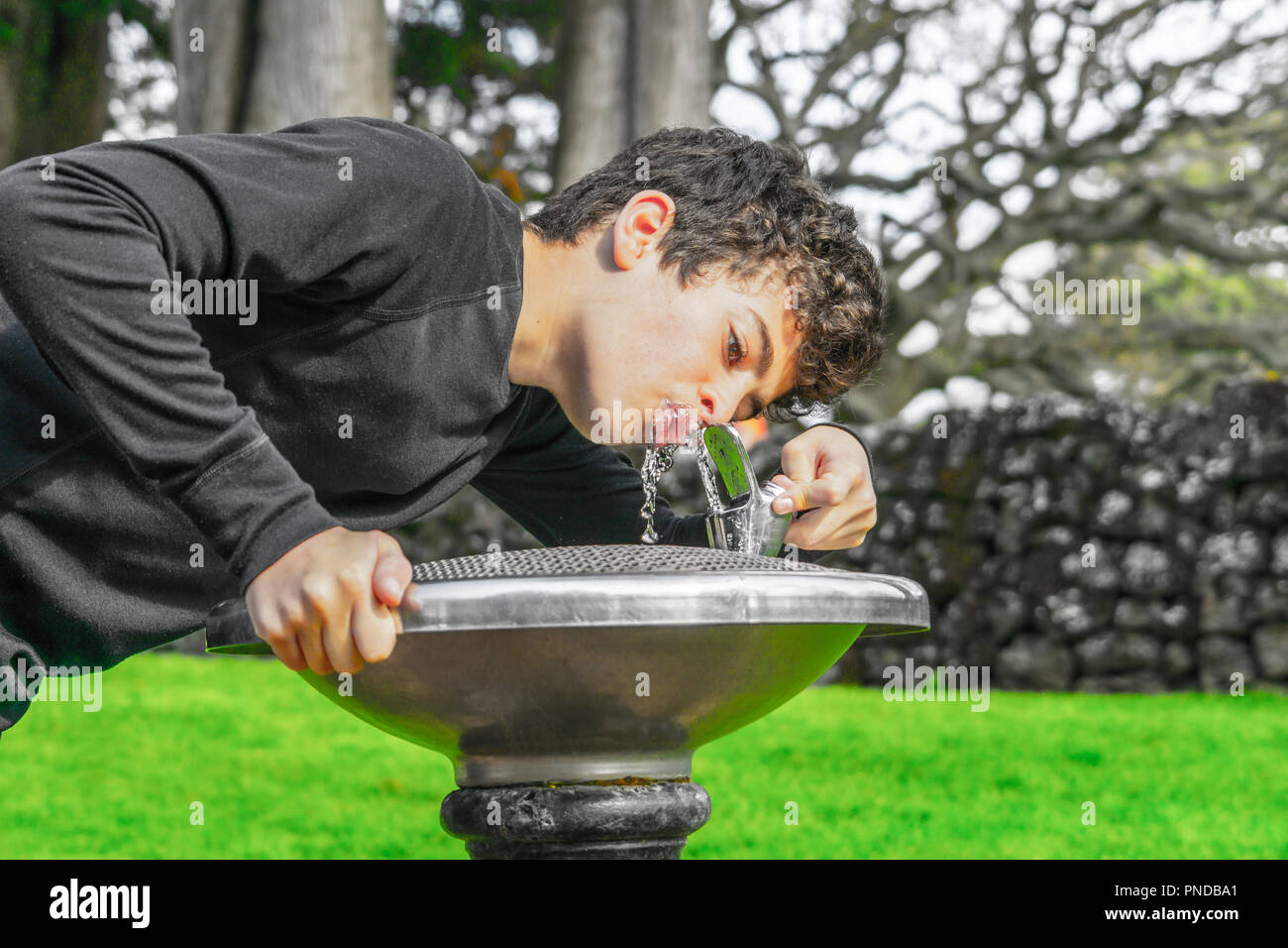 Drinking cool fresh water at water fountain close-up Stock Photo - Alamy
