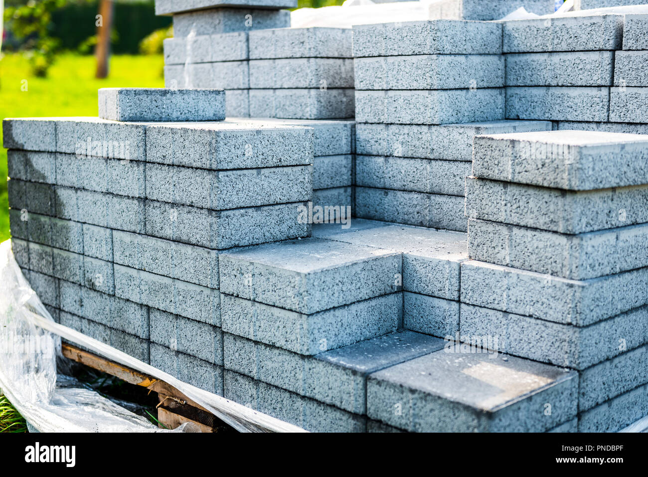Stack of concrete paving slabs tiles ready for laying pavement ...