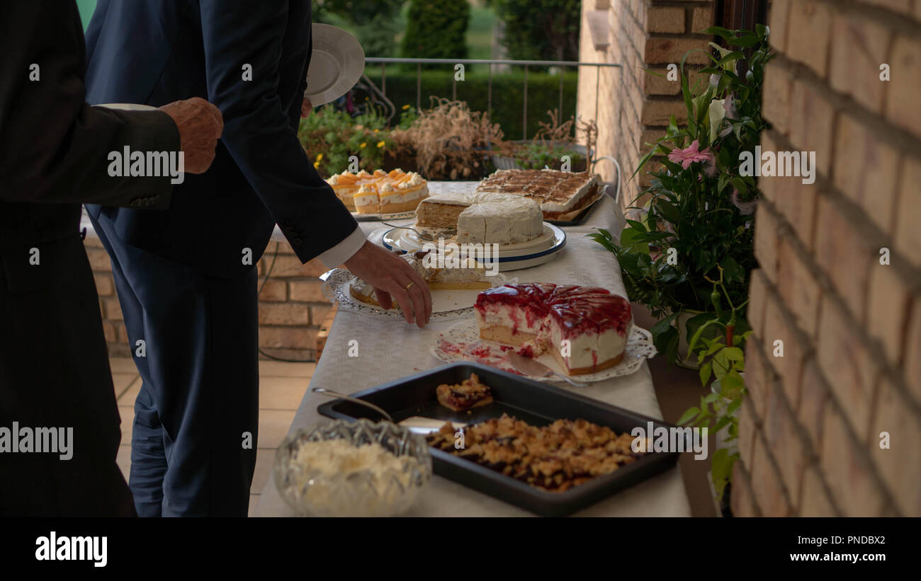 Business people eating lunch at office buffet Stock Photo - Alamy