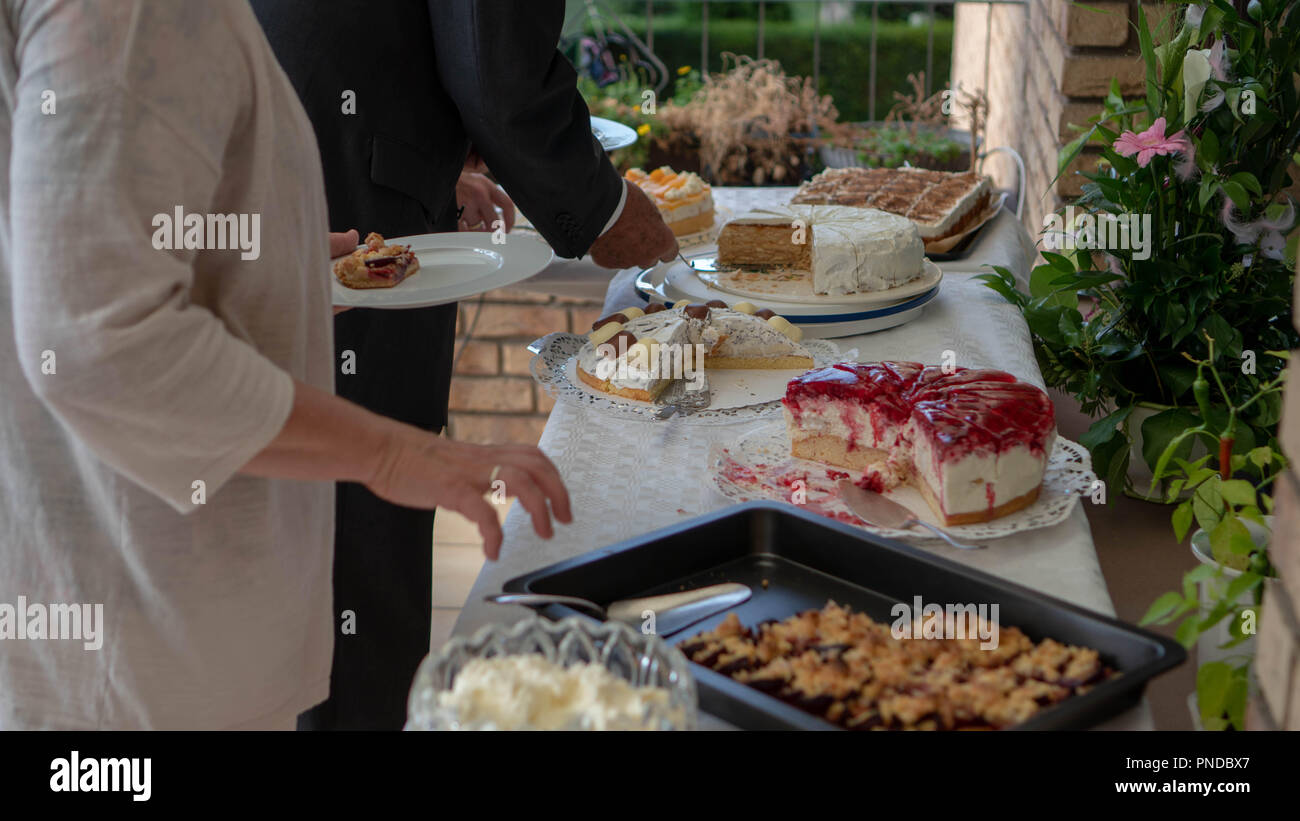 Business people eating lunch at office buffet Stock Photo - Alamy