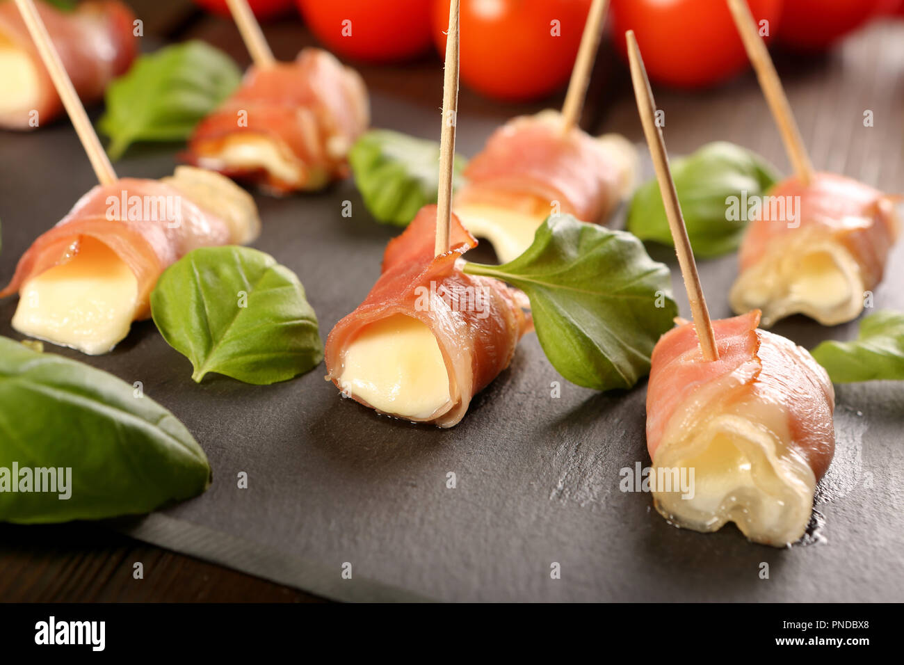 Traditional italian prosciutto ham baked with mozarella cheese Stock ...