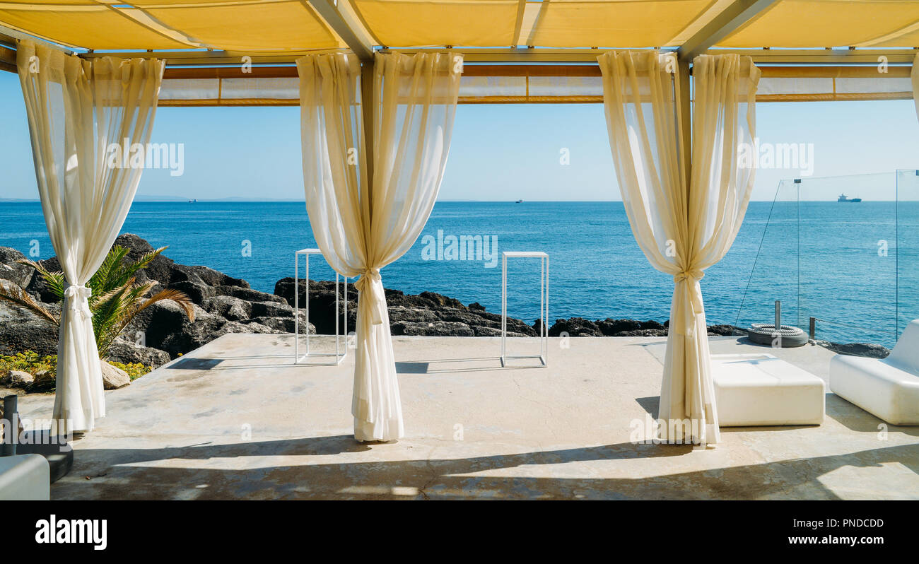 Sea view from summer cabana. Ocean view from beach tent. Holiday relax ...