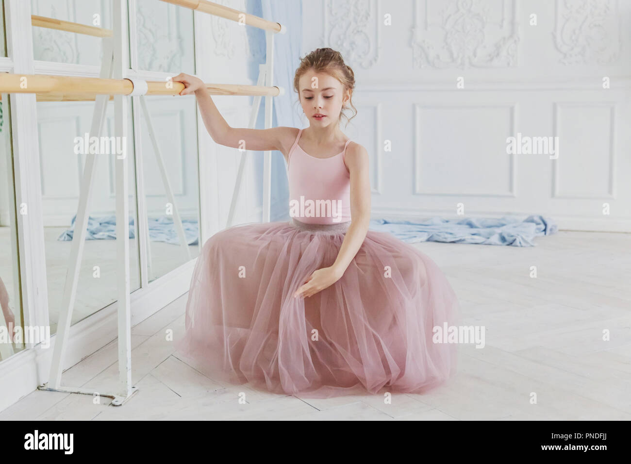 Young classical ballet dancer girl in dance class. Beautiful graceful ...