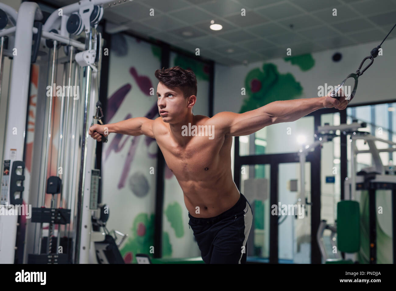 Young and fit man at the gym Stock Photo - Alamy