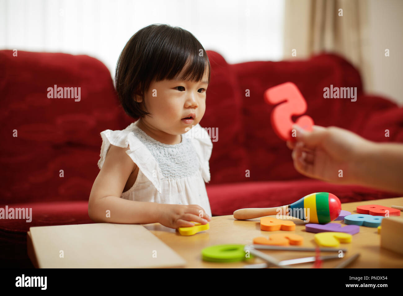 baby girl learning numbers at home Stock Photo - Alamy