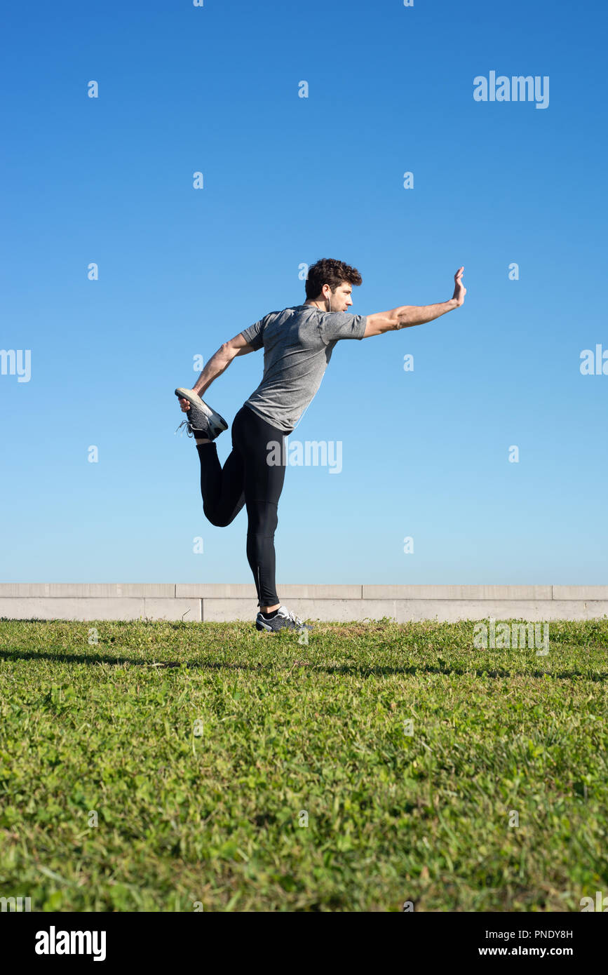 man stretches the body before running space for text down Stock Photo ...