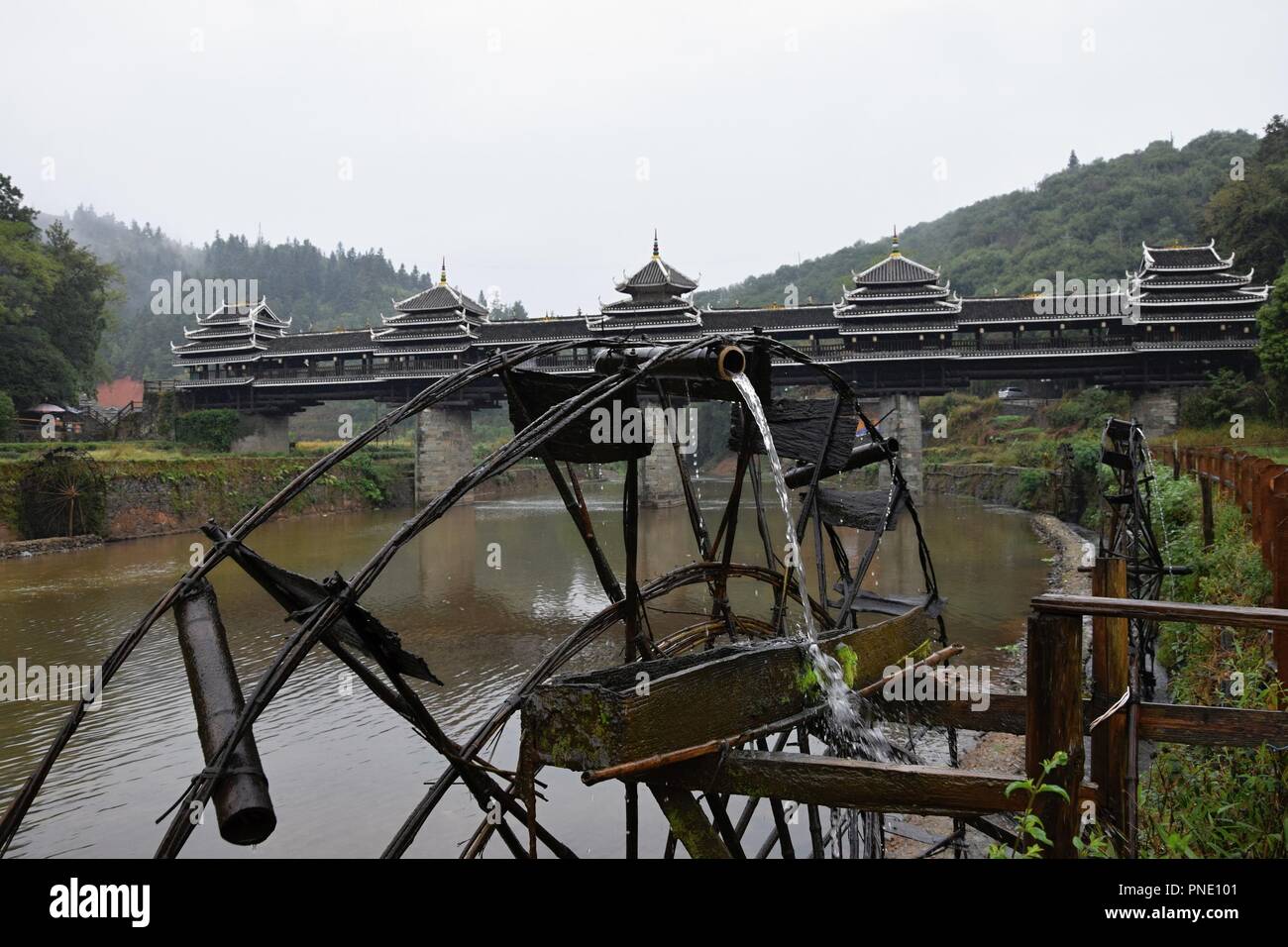 The traditional wooden water mill near an old village in Guizhou ...