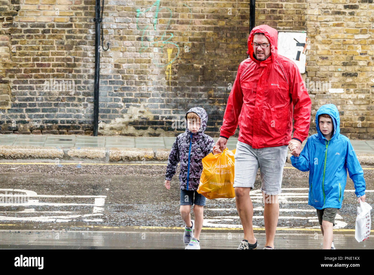 Group of people with their hands in the weather photo hi-res stock ...