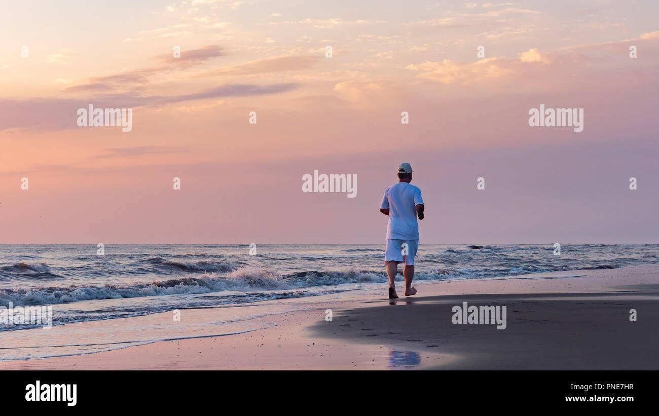 Healthy lifestyle, morning run on the beach Stock Photo - Alamy