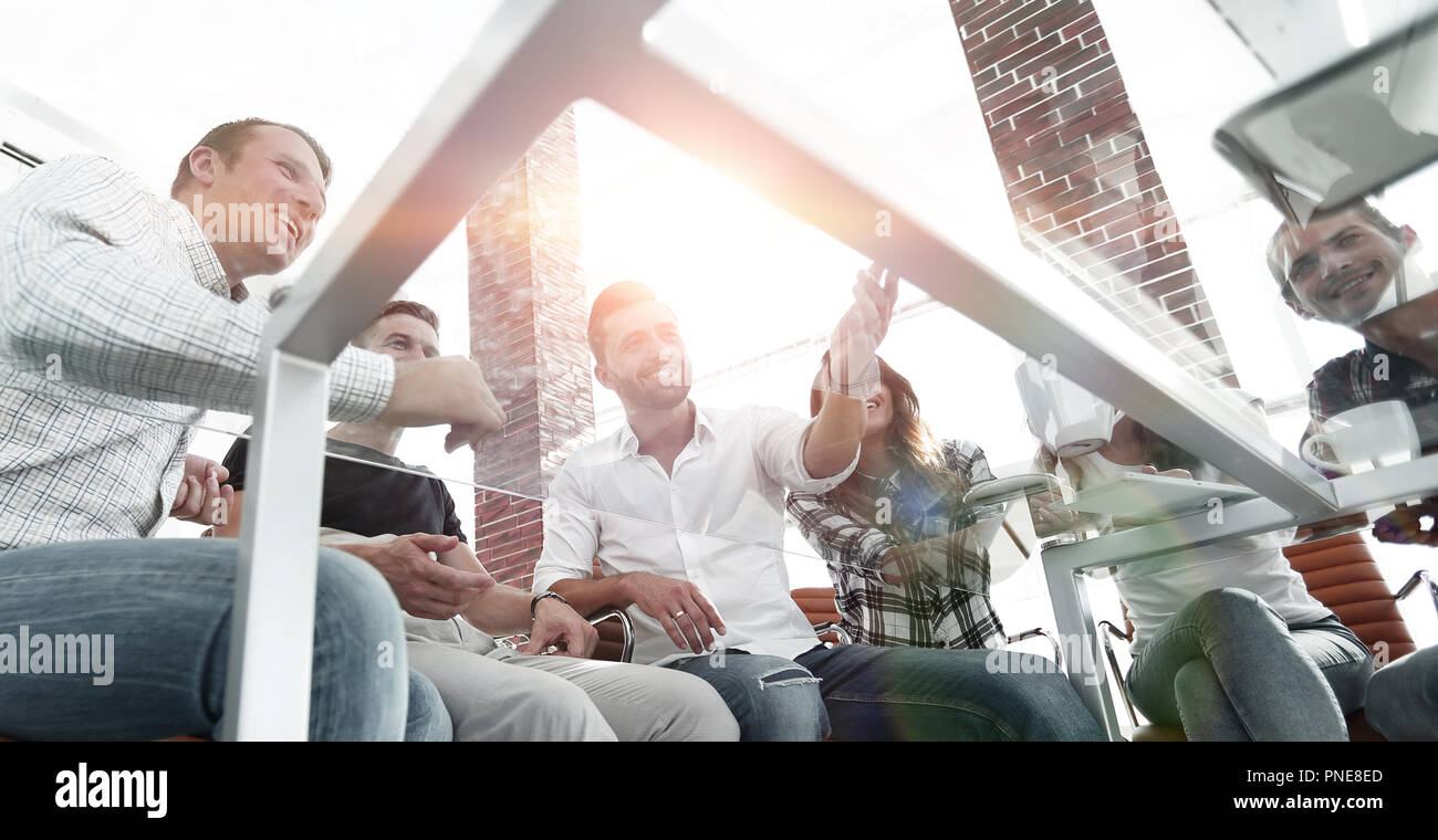 bottom view.employees sitting behind a Desk Stock Photo - Alamy