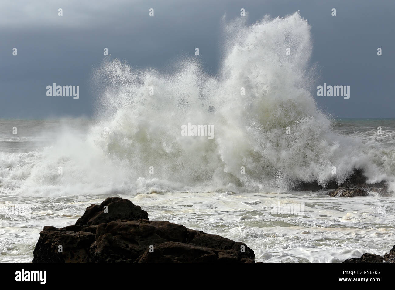 High waves crash against rocks hi-res stock photography and images - Alamy