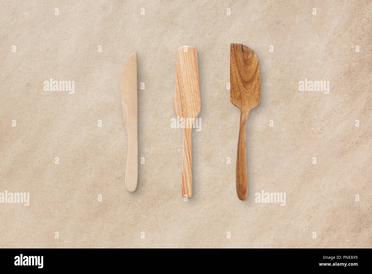 Kitchenware isolate on brown paper texture background Stock Photo - Alamy