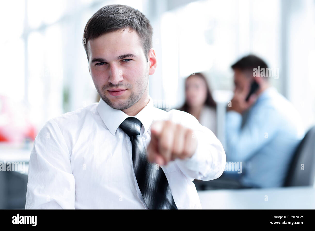 concept of perspective.confident businessman pointing forward Stock ...